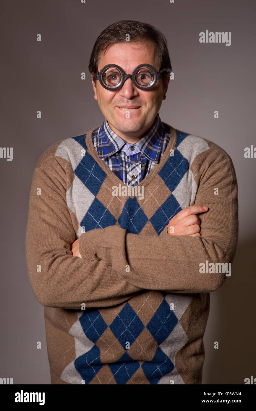 Portrait of smart professor with student smiling together in library ...