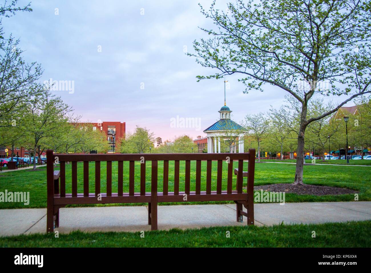 Empty bench at sunset in a square town where the gazebo is hidden Stock ...