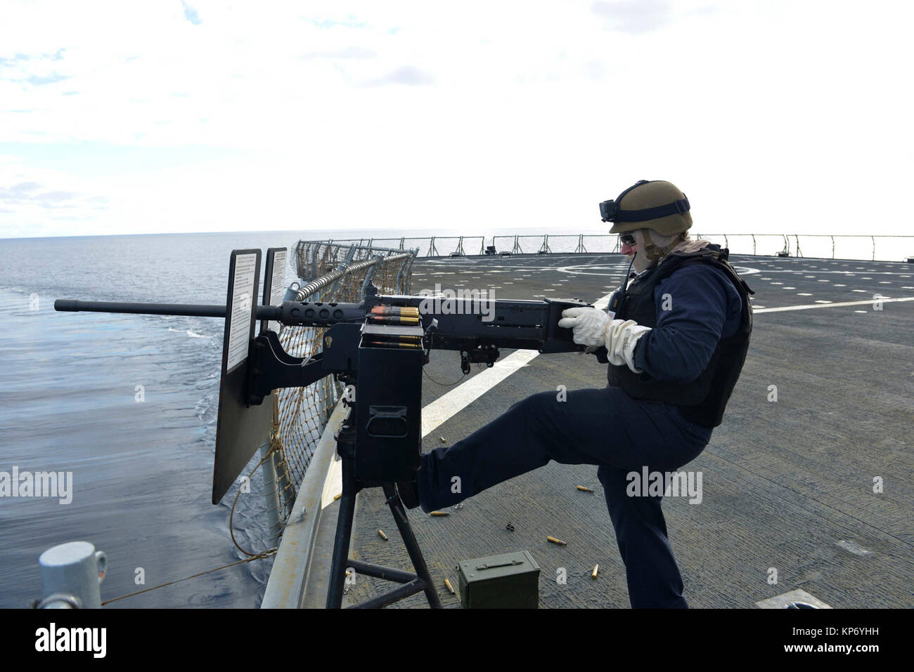 Gunner’s Mate 1st Class Adrian Rodziewicz fires a .50-caliber machine ...