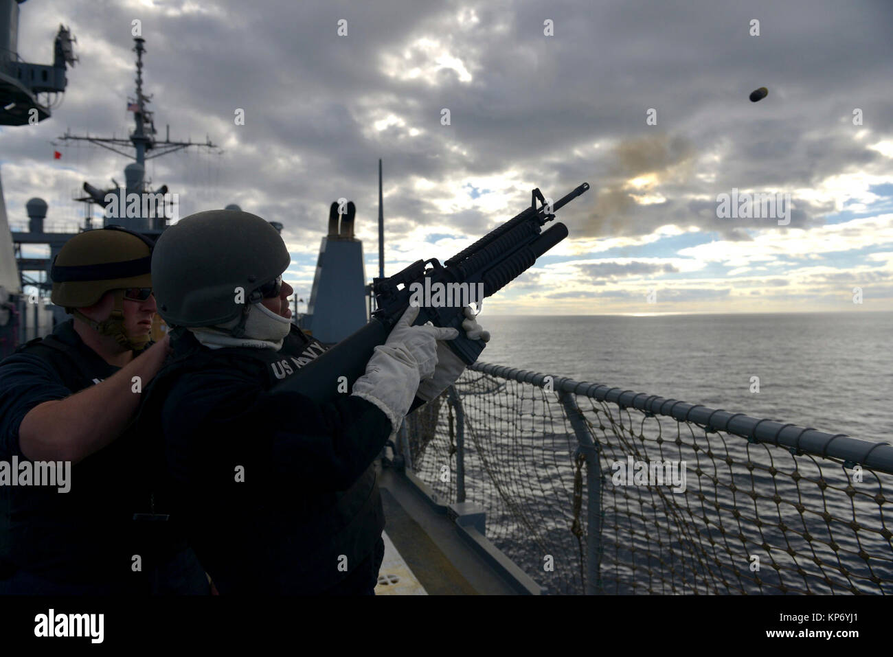 Senior Chief Engineman Rudy Marin fires an M203 grenade launcher during ...