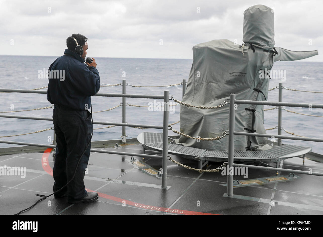 Boatswain's Mate Seaman Demarious Hardy stands watch on the fantail ...