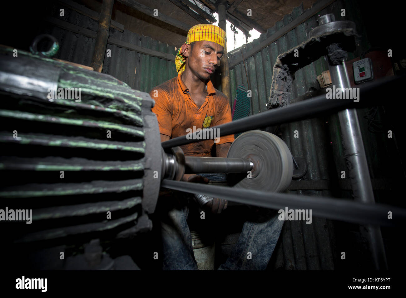 Spoon-Making Factory Workers at a steel recycling and steel spoon ...
