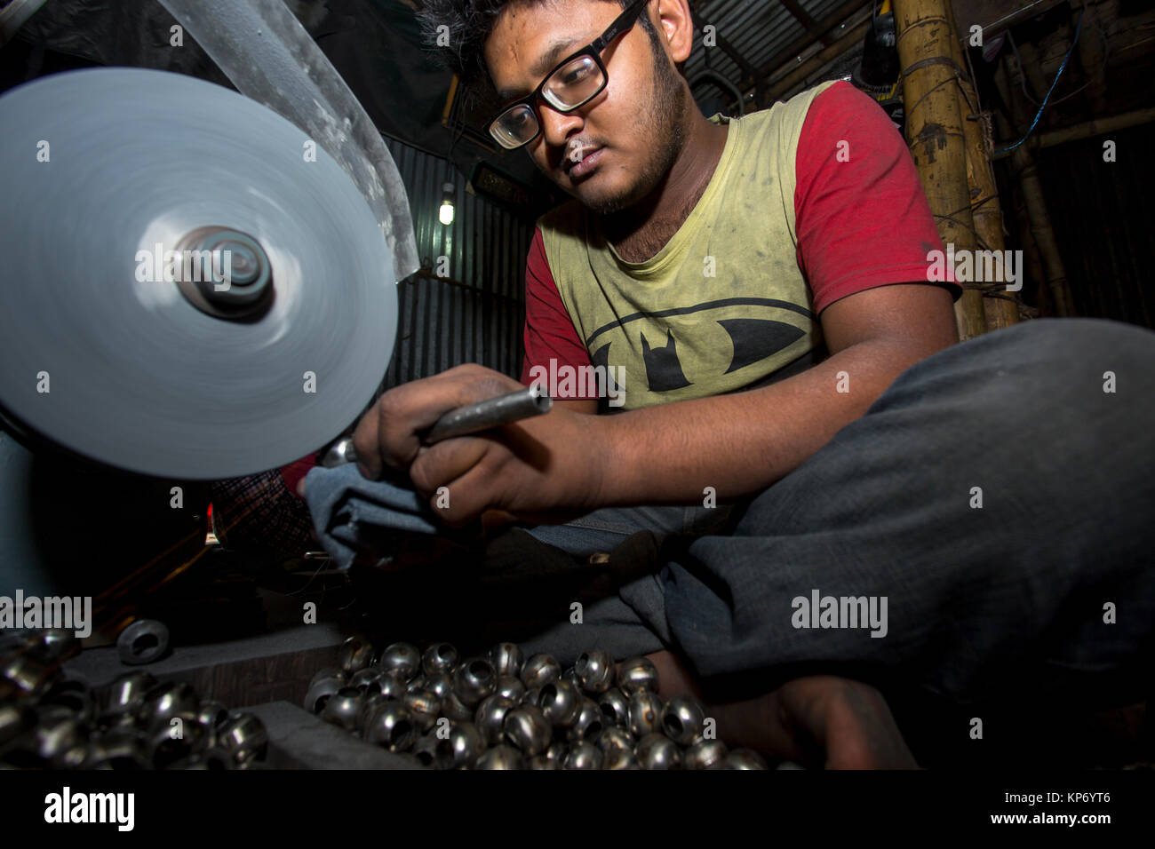 A labor are polishing steel ball in a factory Stock Photo - Alamy