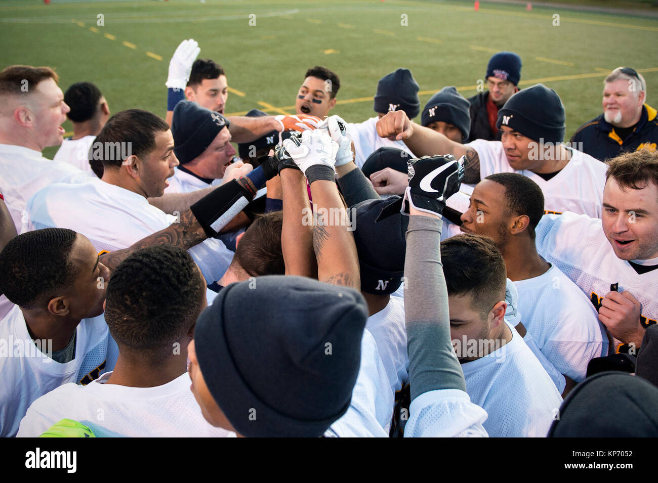Sailors from Navy Region Northwest huddle up after winning the 18th ...