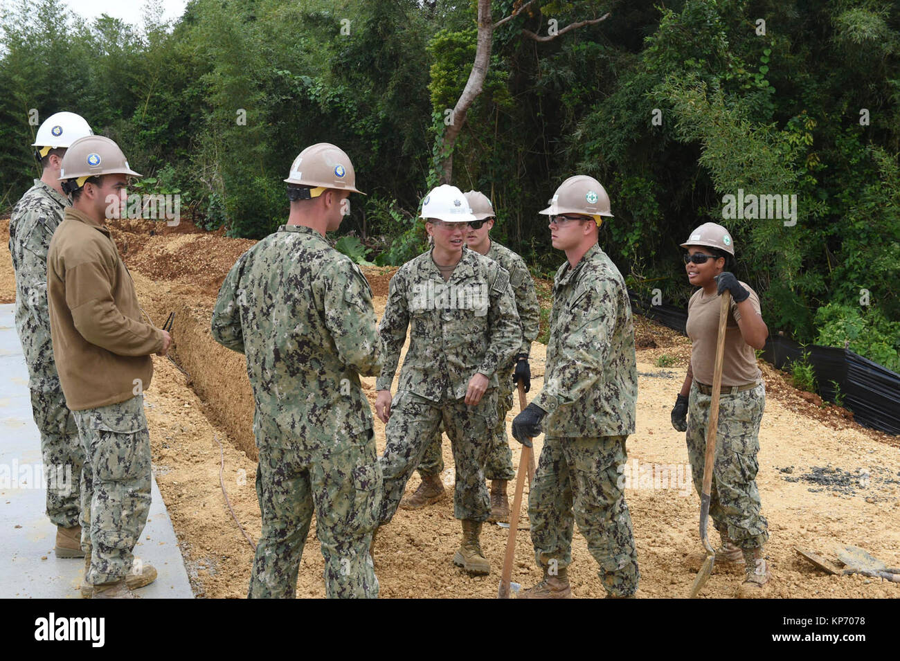 Naval Mobile Construction Battalion (NMCB) 4 Commanding Officer, Cmdr. James Cho, speaks with ...