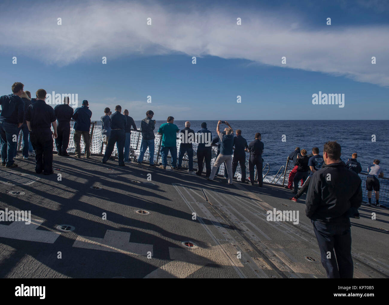 Navy warship, people on sloping deck Stock Photo - Alamy