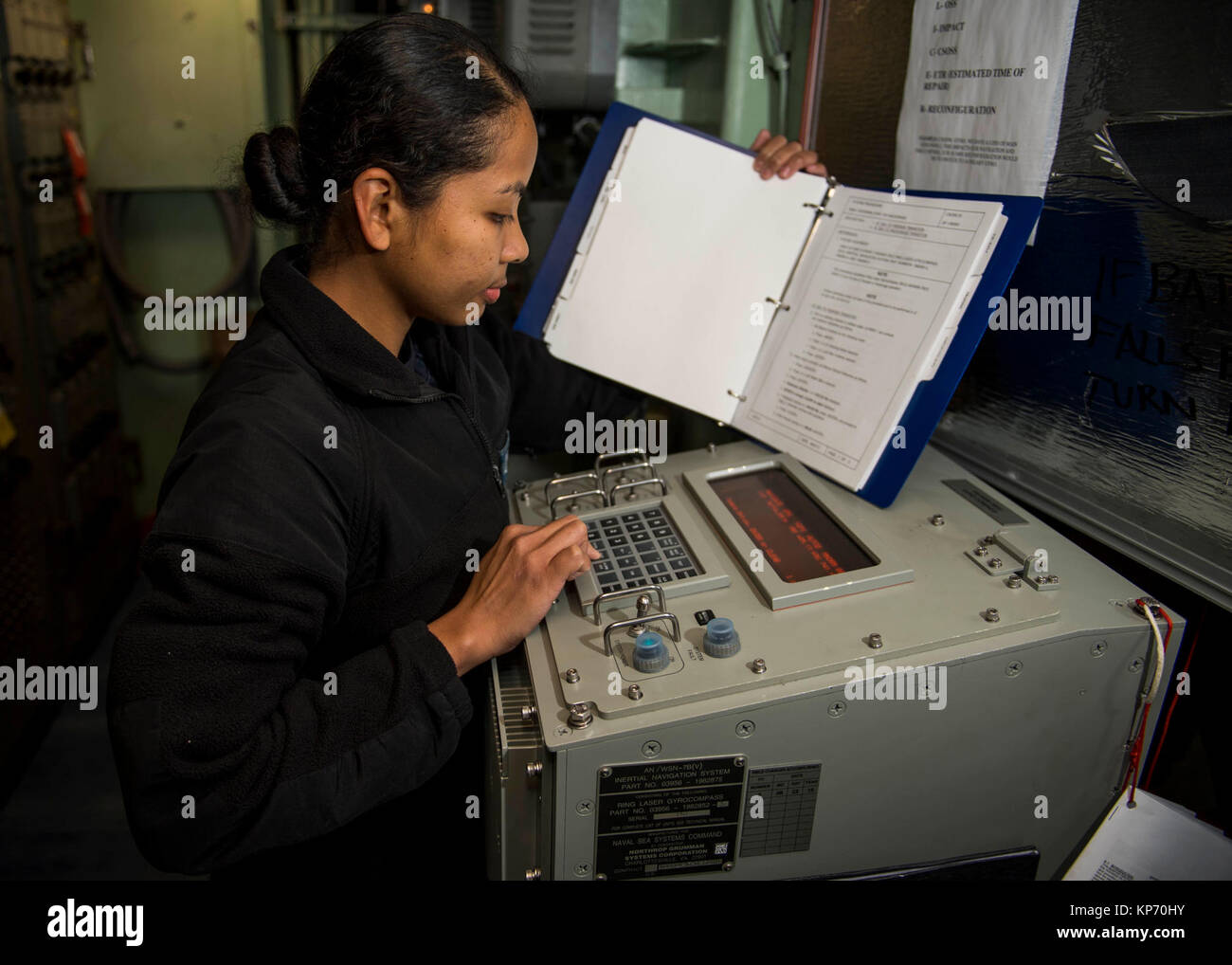 Interior Communications Electrician 2nd Class Karima Richard performs ...