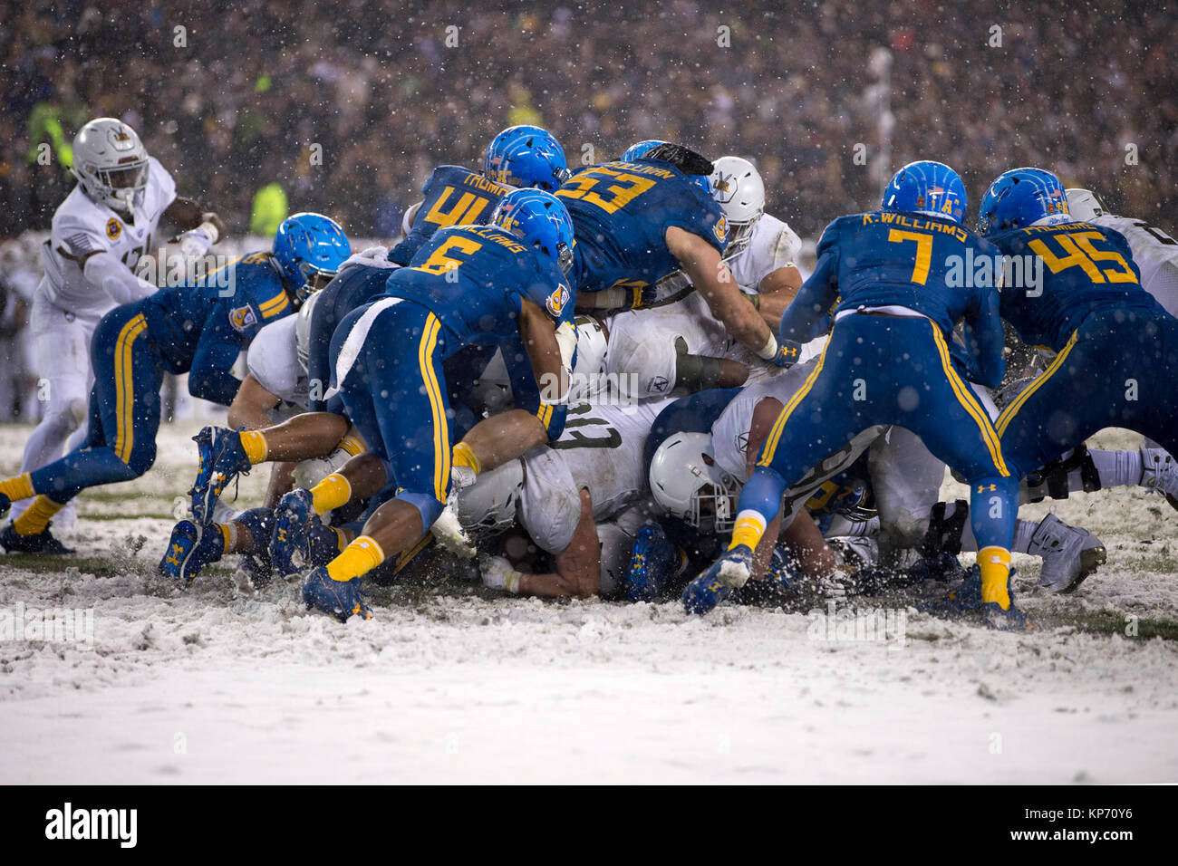 In the middle of pile up, Army quarterback Ahmad Bradshaw breaks the ...