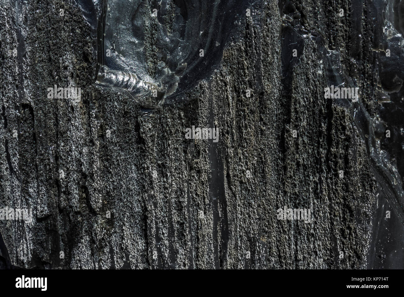 Close-up of obsidian, with its combination of dark color and glassy ...