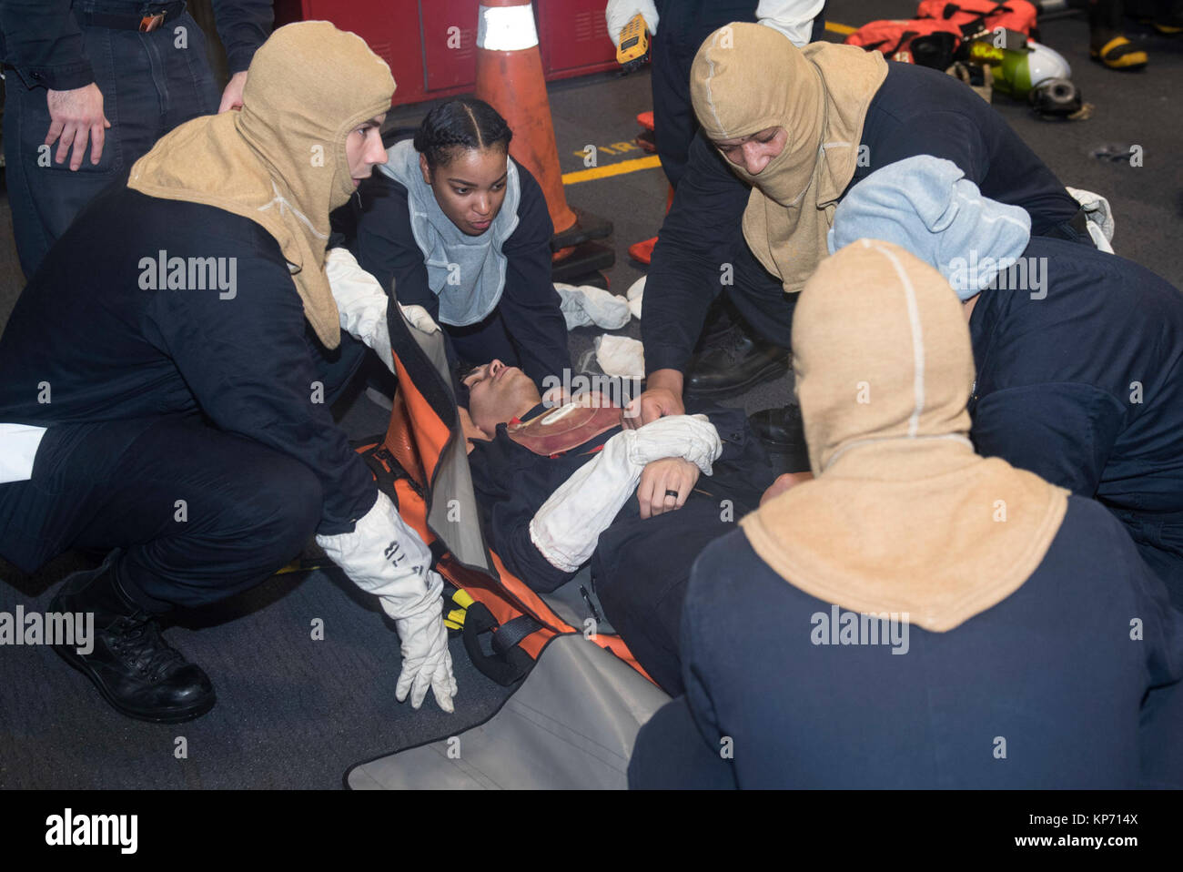 Sailors administer first-aid to a Sailor with simulated injuries in the ...