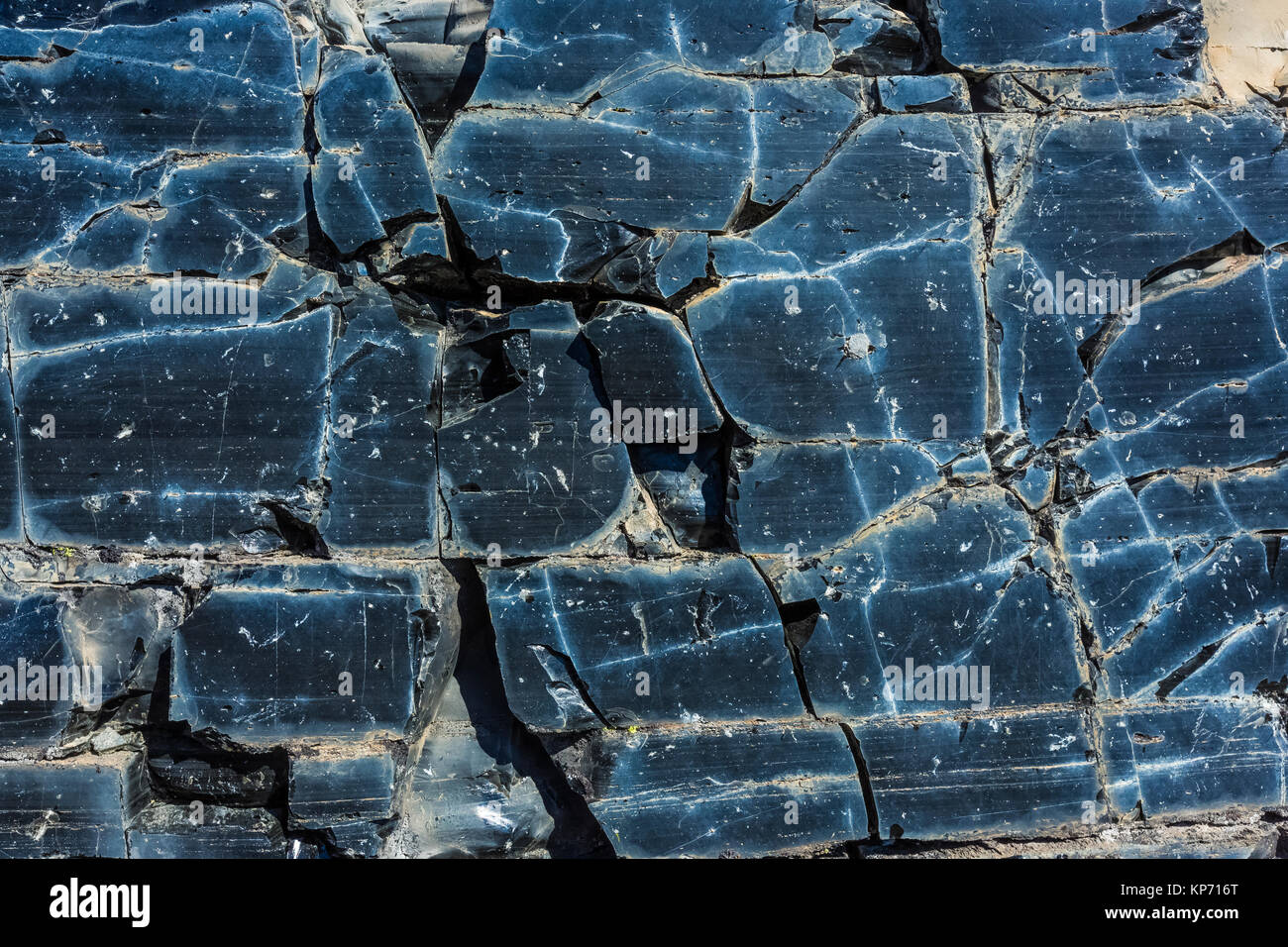 Close-up of obsidian, with its combination of dark color and glassy ...