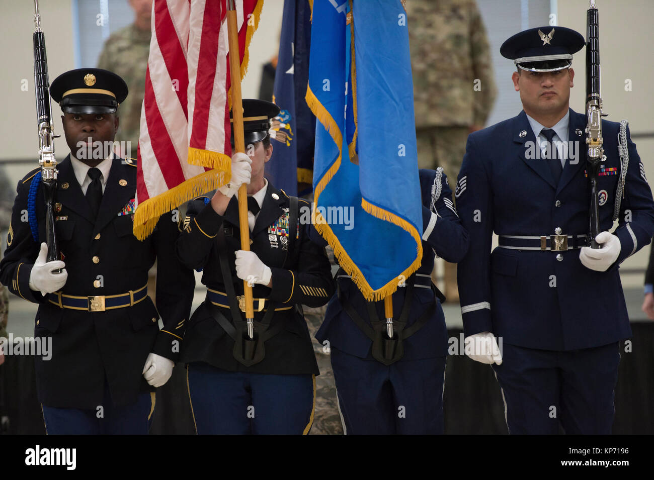Color guard members of the Oklahoma Army and Air National Guard remove ...