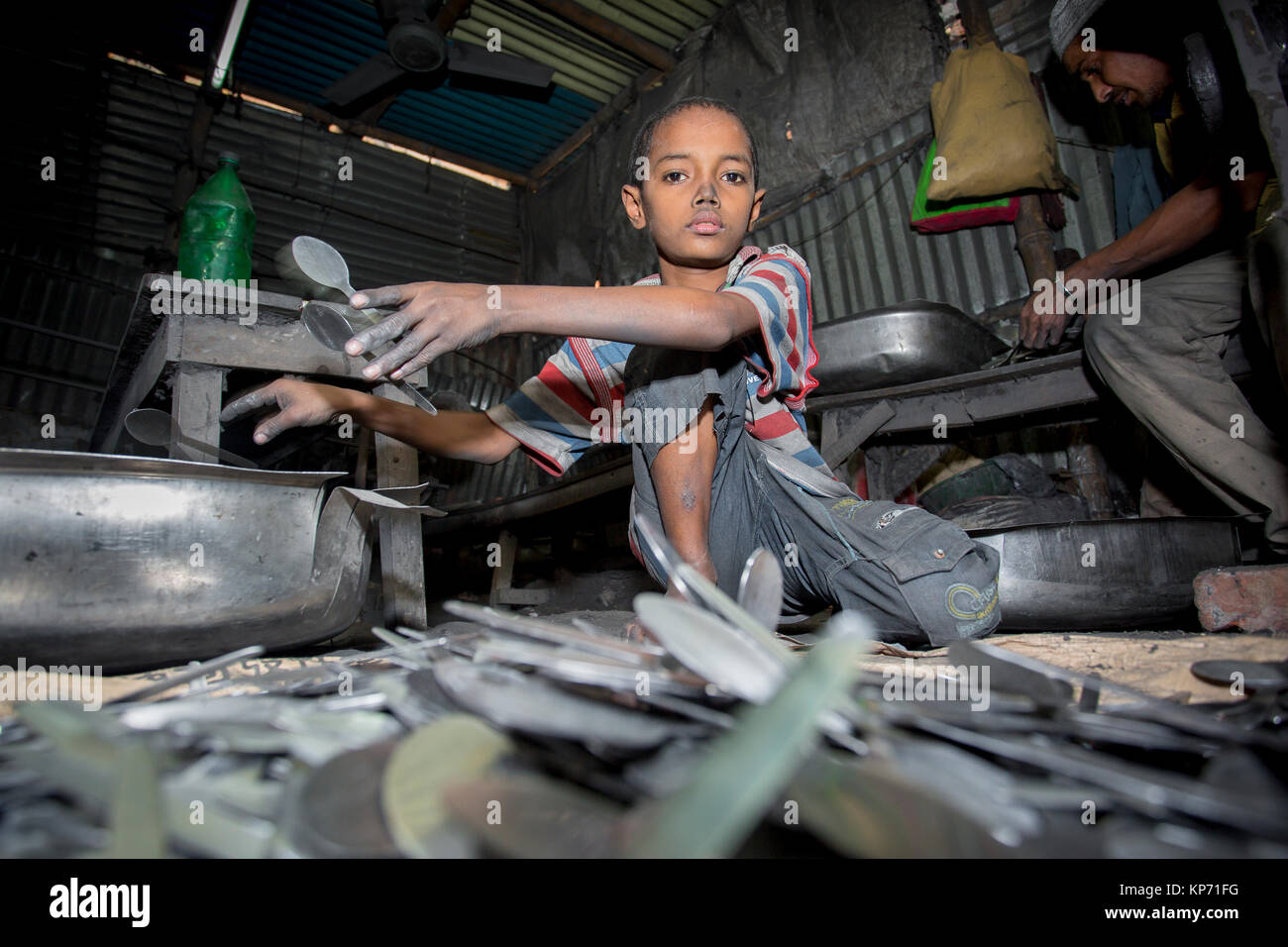 A child labor working Spoon-Making Factory near of Burigonga River at ...
