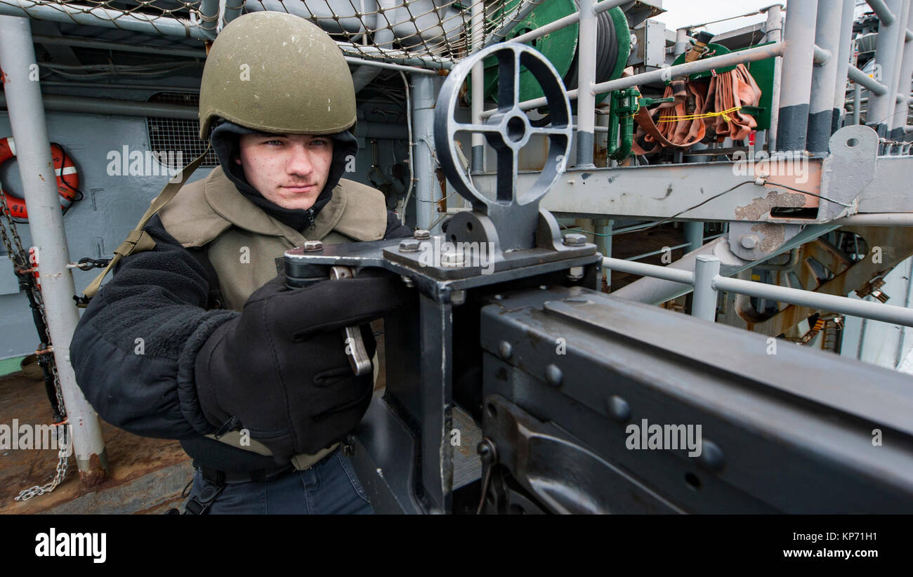 Aviation Ordnanceman Airman Dakota Beckett mans a M2HB machine gun ...