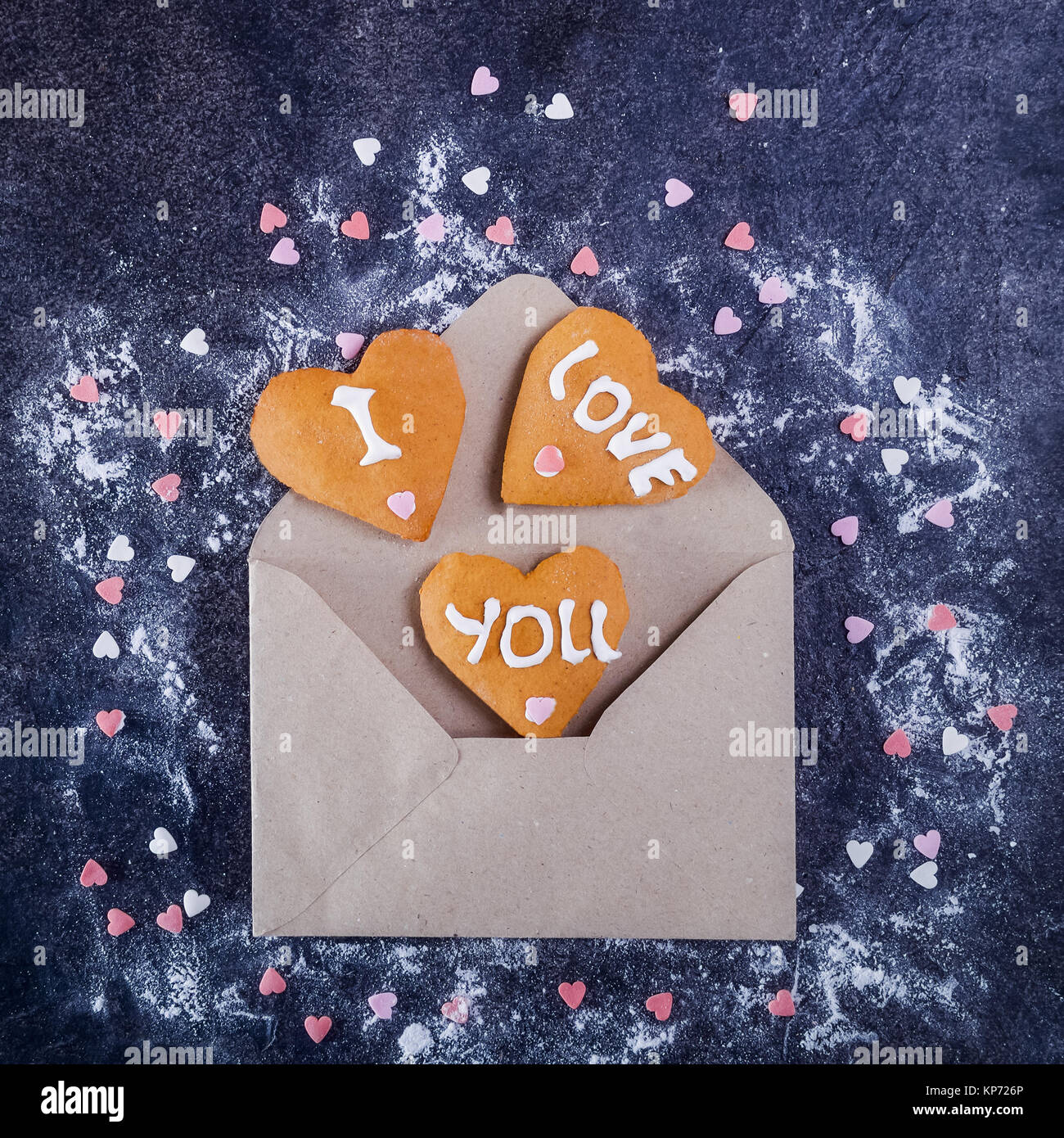 Open craft paper envelope with heart shaped homemade ginger cookies ...