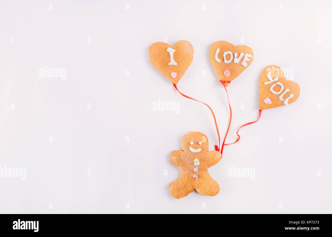 Homemade Gingerbread man with balloons in the shape of hearts with ...