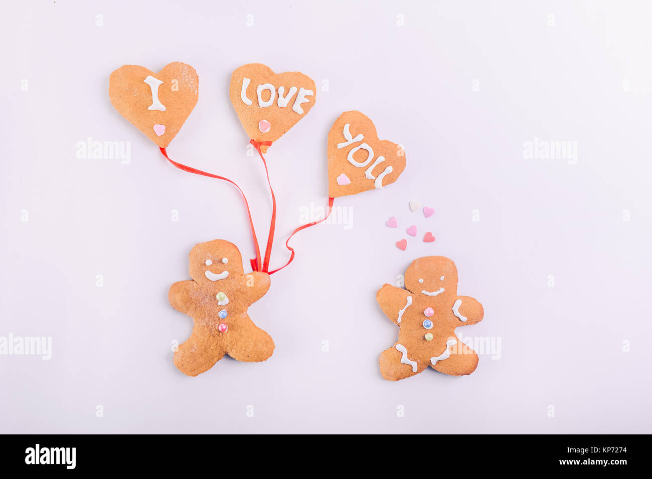 Gingerbread cookies couple for Valentines Day. Man with balloons in the ...