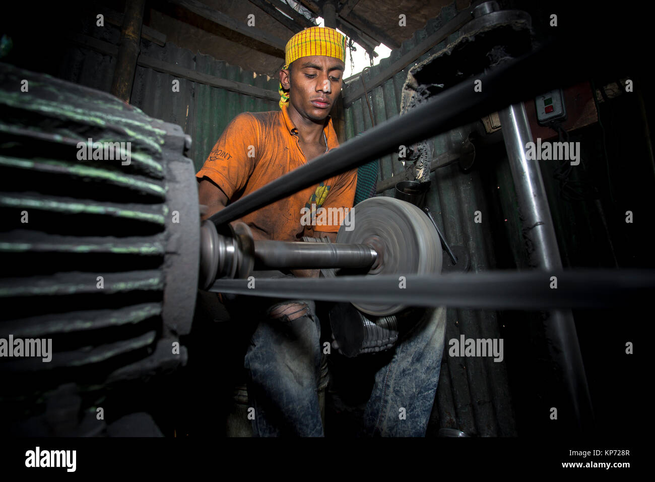 Spoon-Making Factory Workers at a steel recycling and steel spoon ...