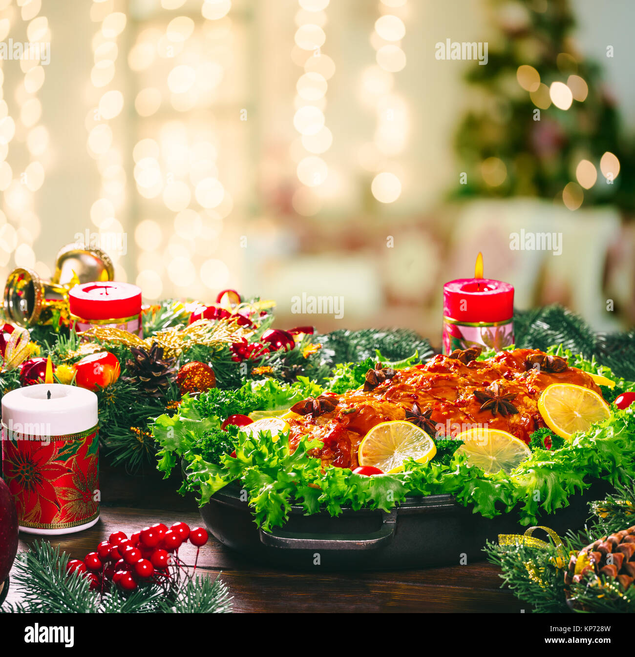 Christmas table dinner time with roasted meats decorated in New Year ...