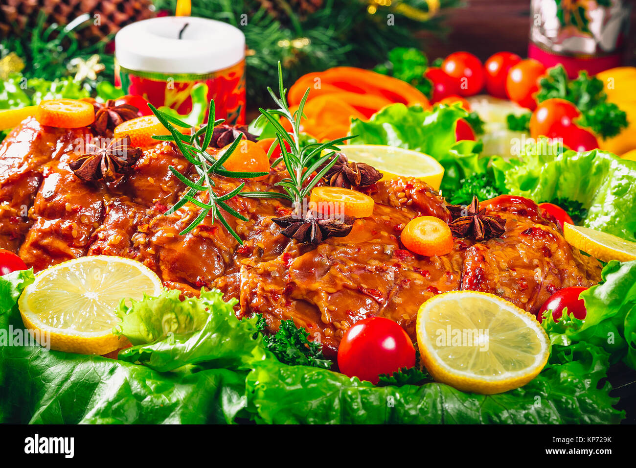 Christmas table dinner time with roasted meats, candles and New Year ...