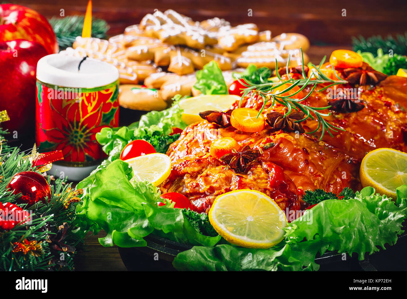 Christmas table dinner time with roasted meats, candles and New Year ...