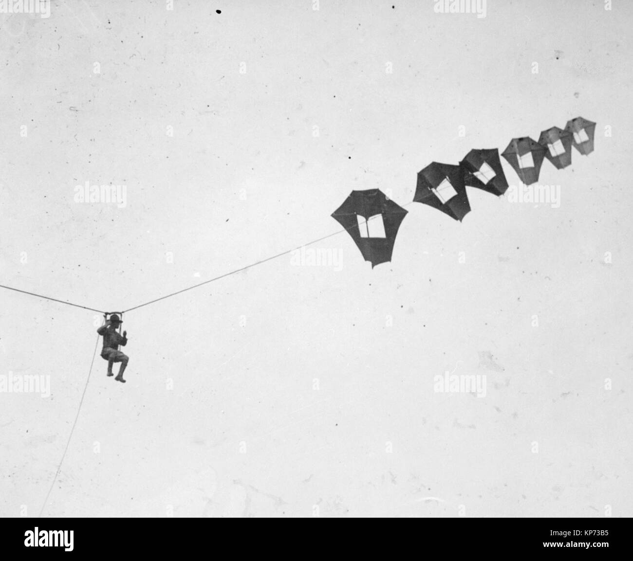 Lieutenant Kirk Booth of the U.S. Signal Corps being lifted skyward by ...