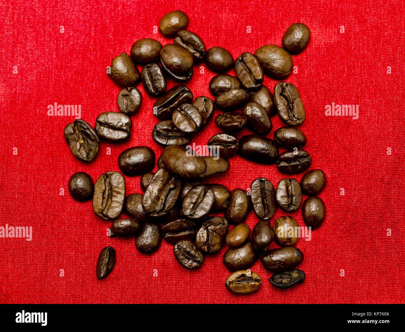 Coffee Beans On Red Stock Photo - Alamy