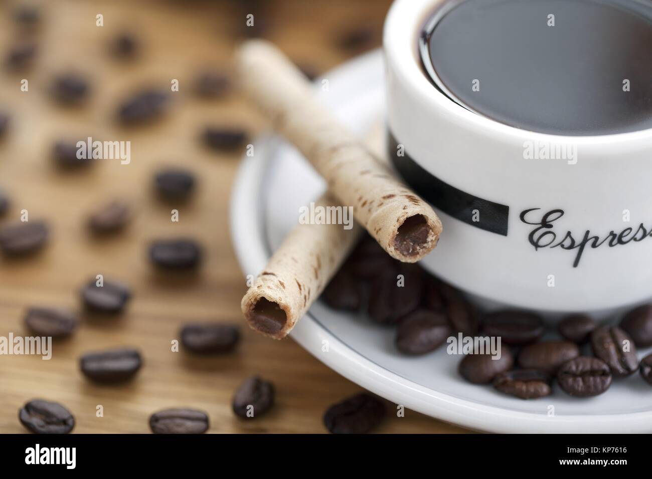 coffee cup and chips with beans Stock Photo - Alamy
