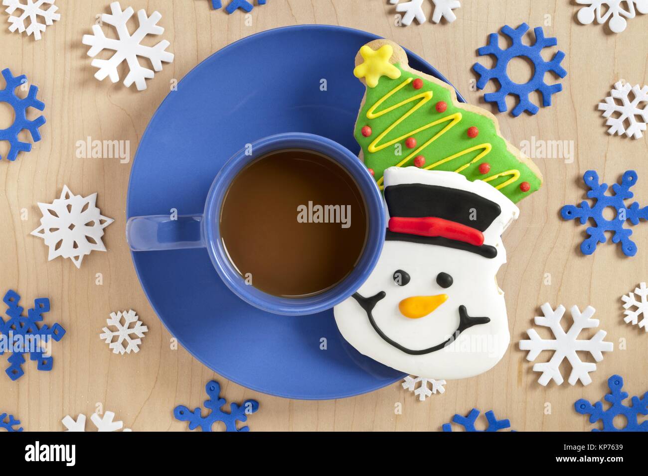 coffee with a snowman cookie Stock Photo - Alamy