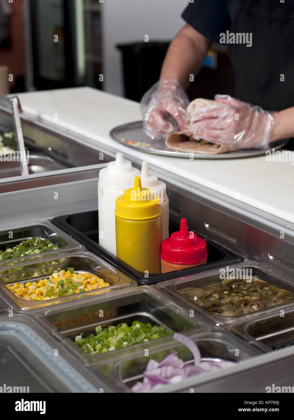 cropped image of a chef making burrito Stock Photo - Alamy