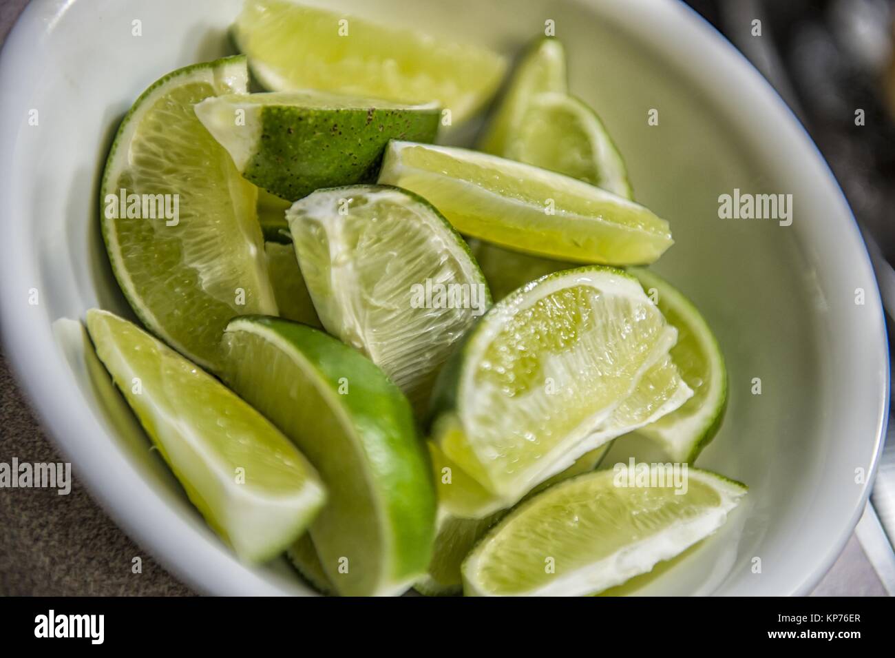 cut lime in bowl Stock Photo - Alamy
