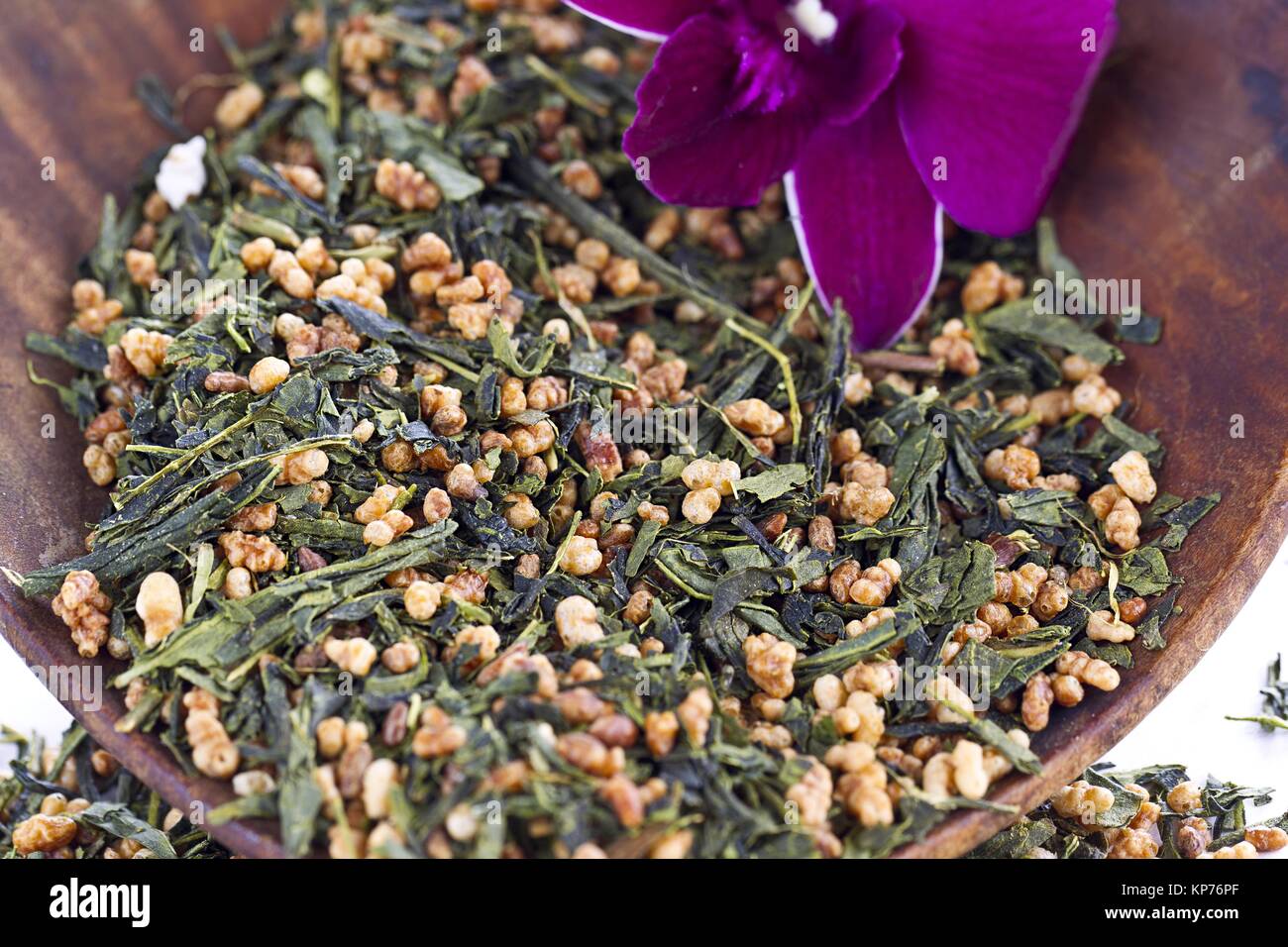 dried tea leaves and pink flower Stock Photo - Alamy