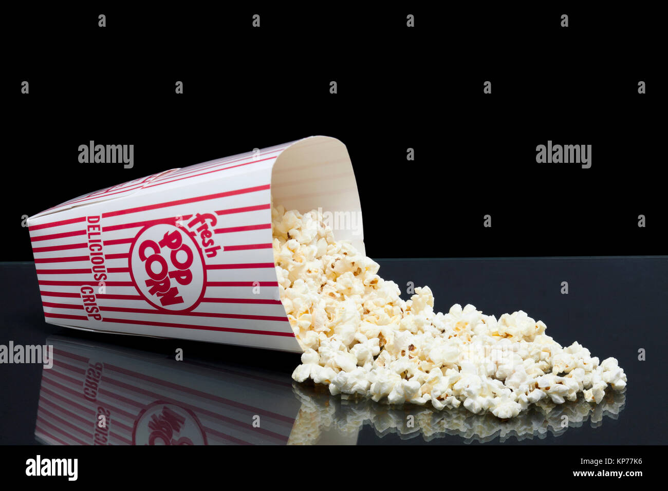 bucket of spilled popcorn Stock Photo - Alamy