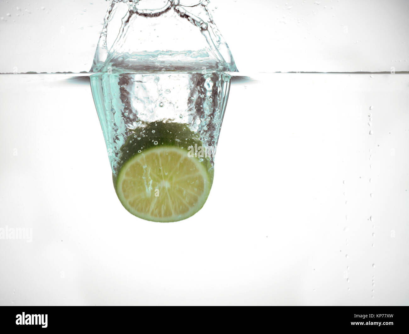dropping lime in water Stock Photo - Alamy
