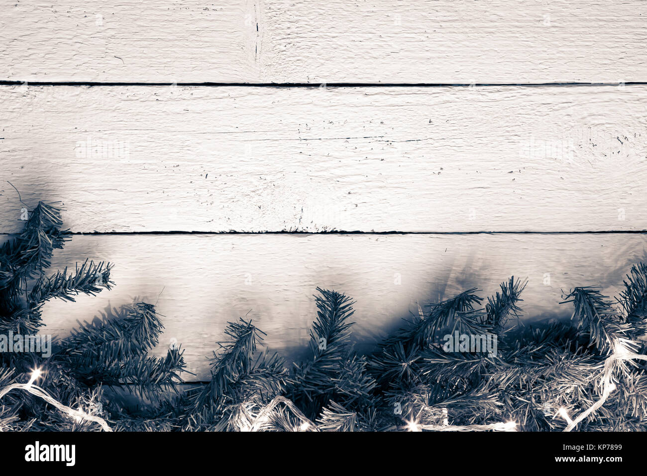 Wooden white texture background with christmas fir tree and ligh Stock ...
