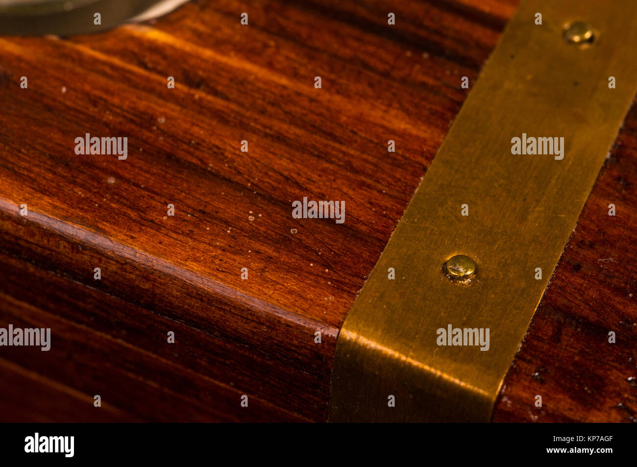 dark weathered teak wood with copper details, close up Stock Photo - Alamy
