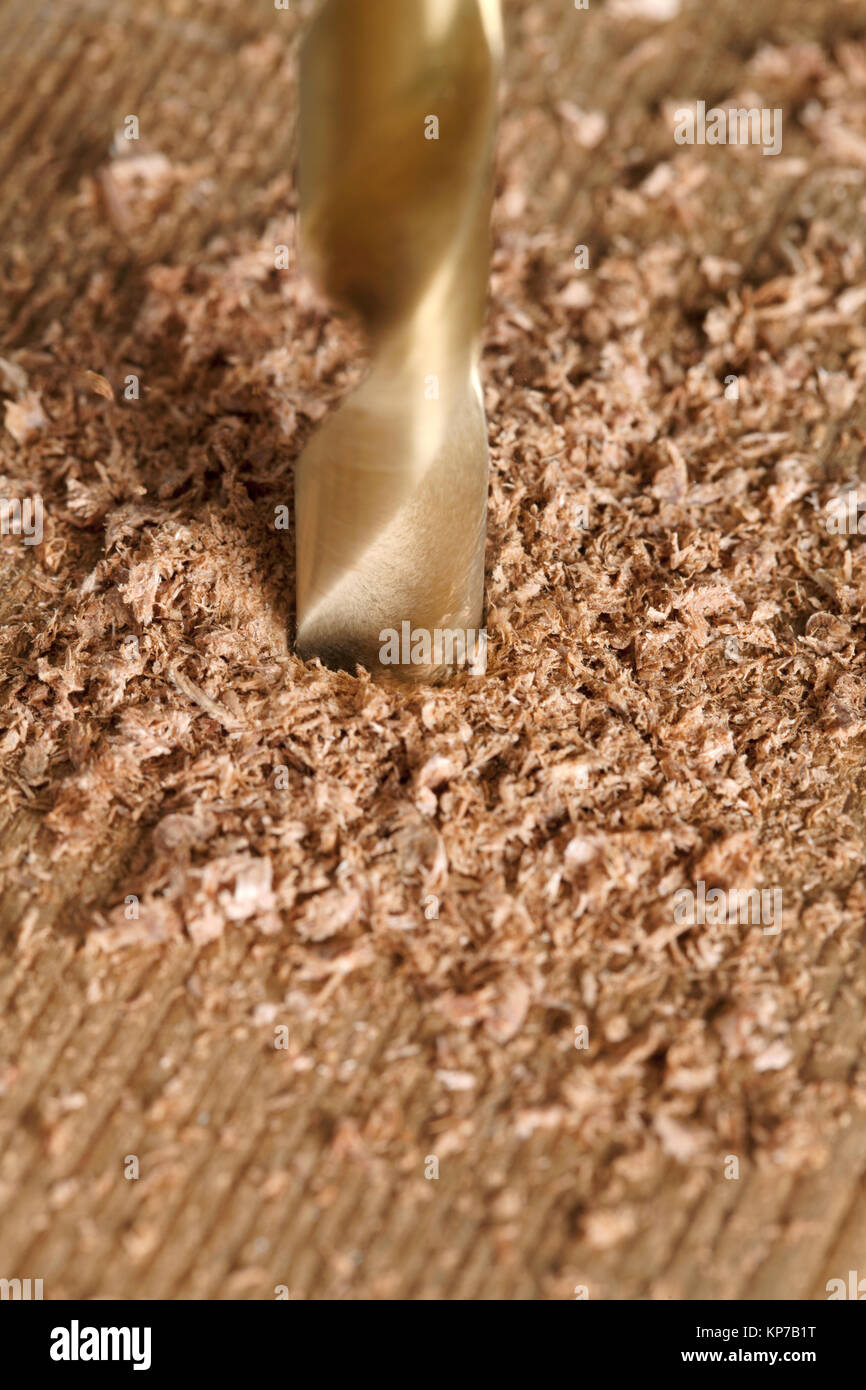 drilling a hole piece of wood plank Stock Photo - Alamy