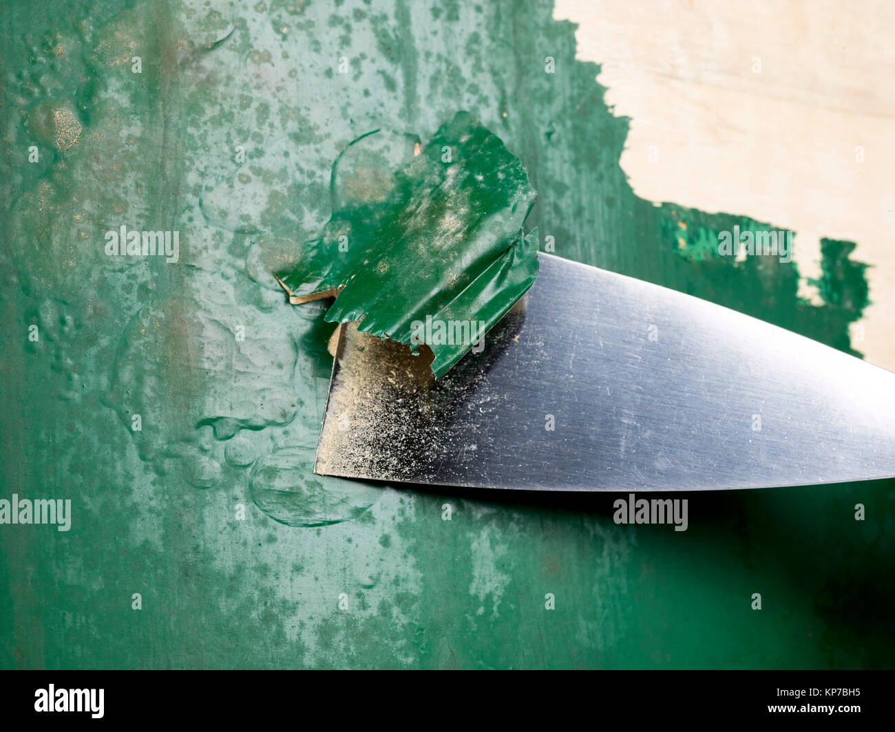 removing paint using a chisel Stock Photo - Alamy
