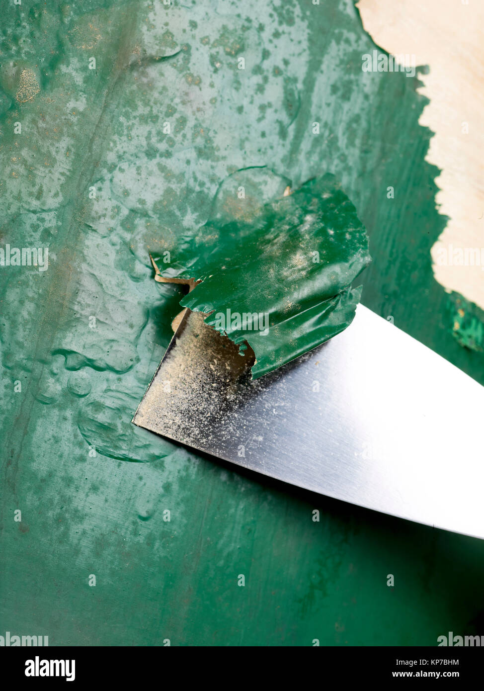 scraping paint on the wall Stock Photo - Alamy
