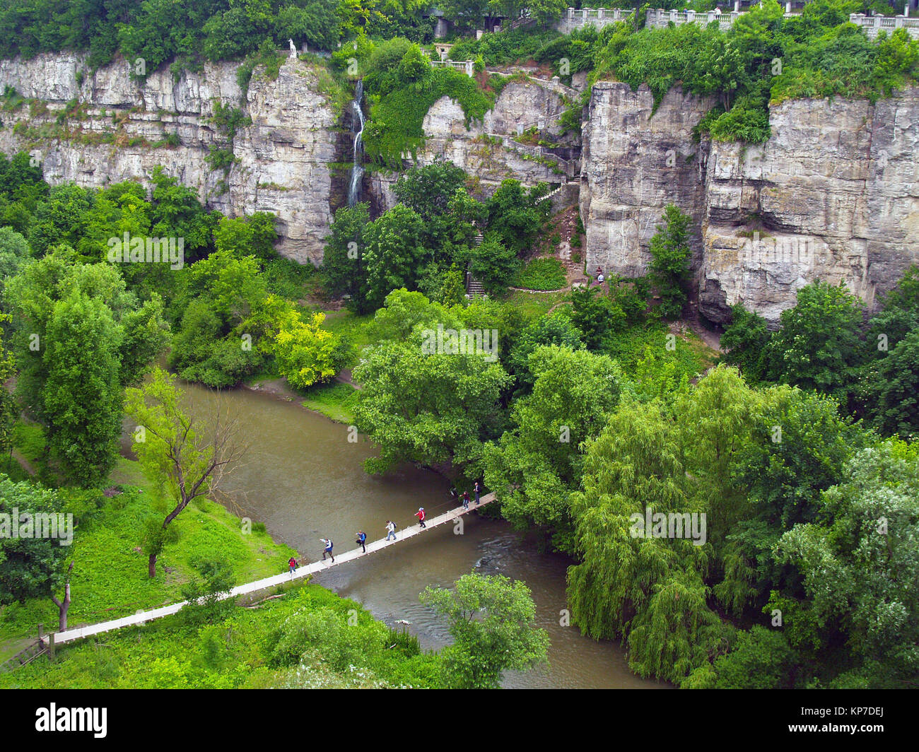 Bridge to a huge mountain, a photograph from the height: a rocky gorge ...