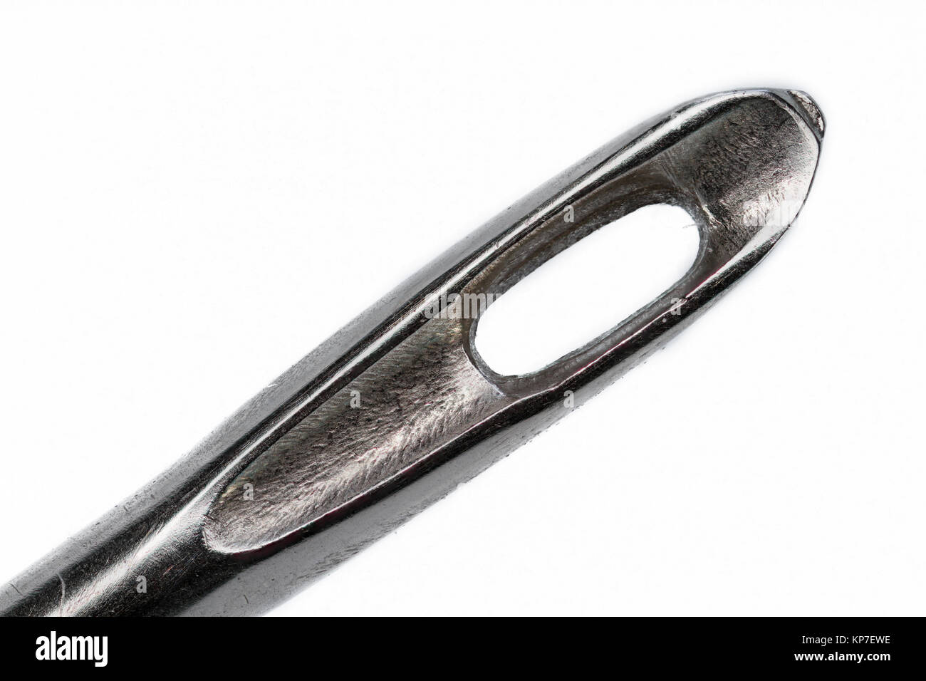 Extreme macro of a needle, needle's eye with isolated on white ...