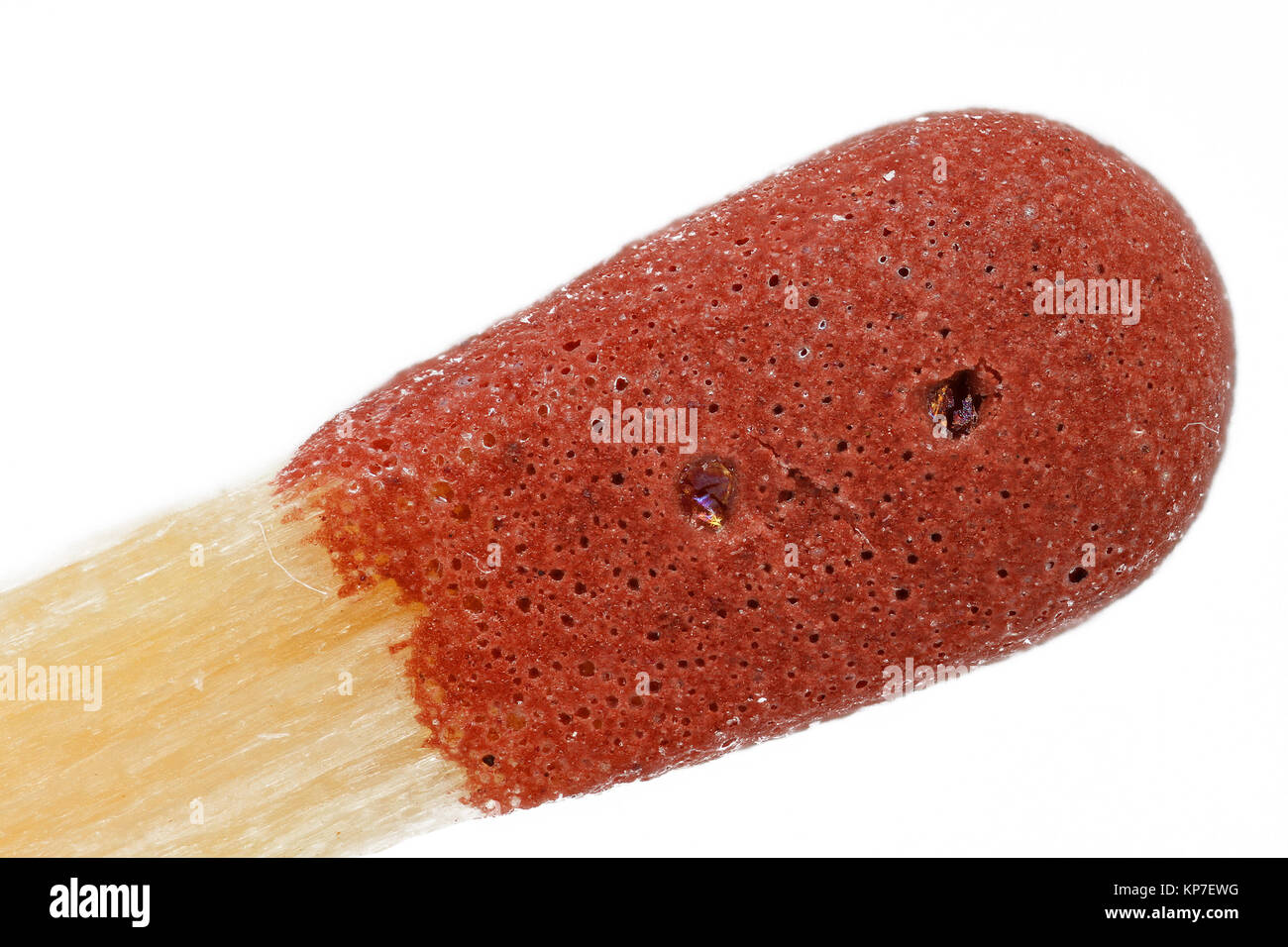 Extreme macro close-up of a wooden match isolated on white background ...