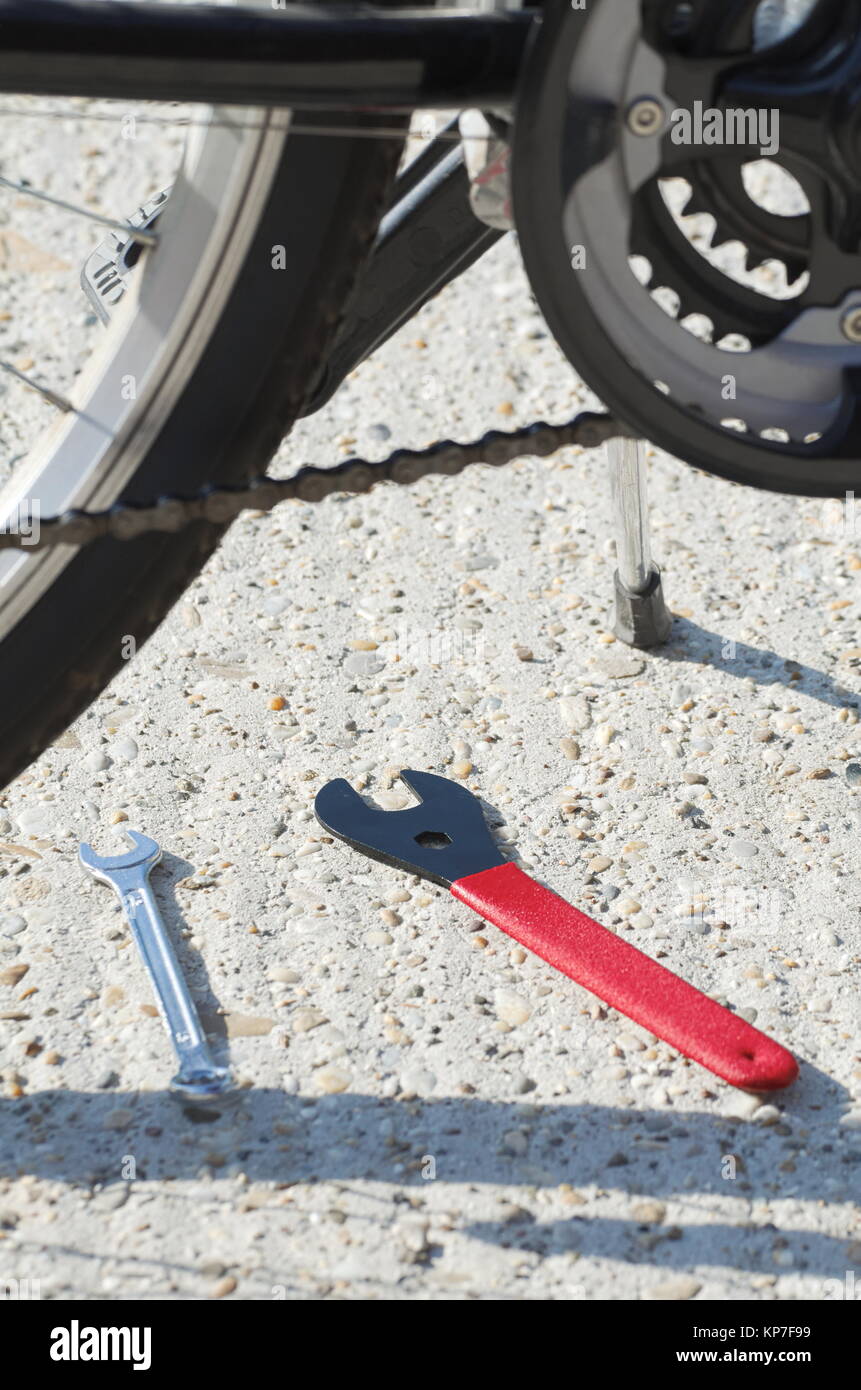 Black Bicycle Closeup with Cone Spanner Wrench Tools Stock Photo - Alamy