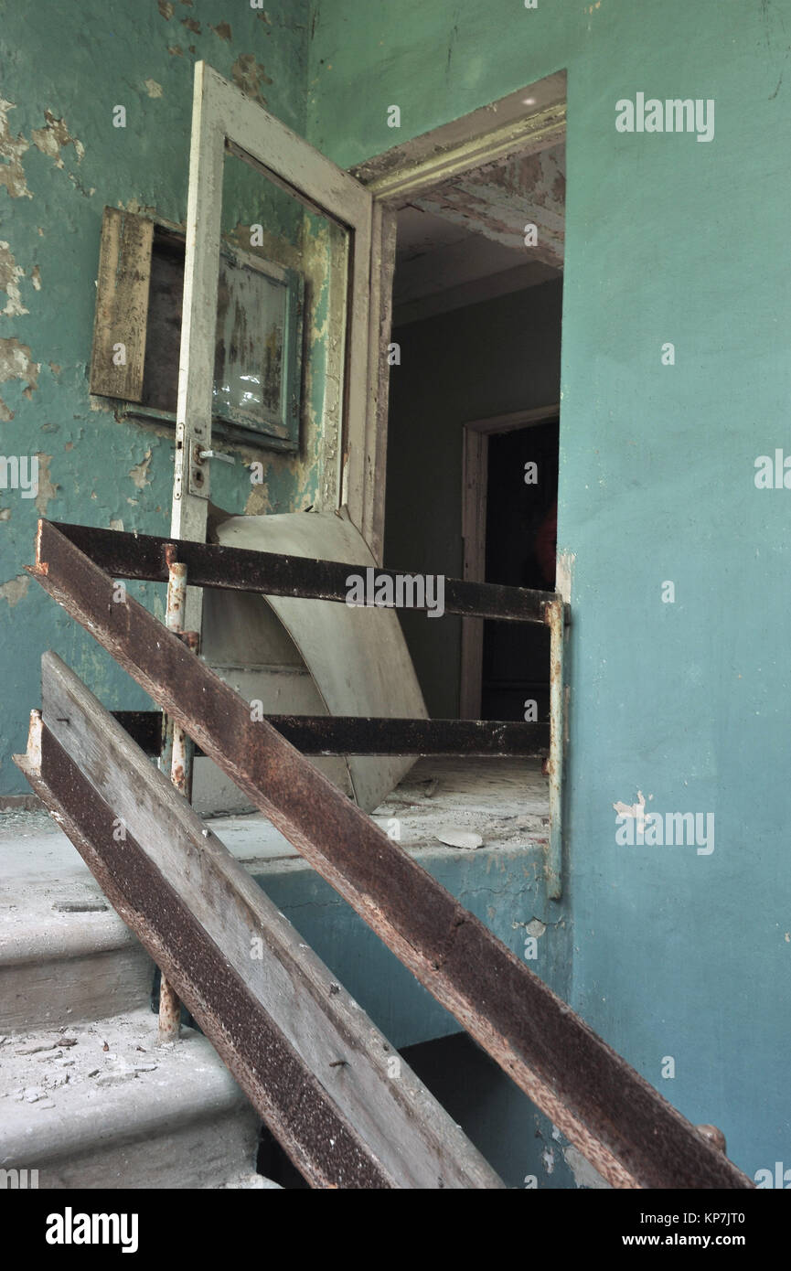 Entrance and staircase with handrails to the destroyed house in Pripyat ...
