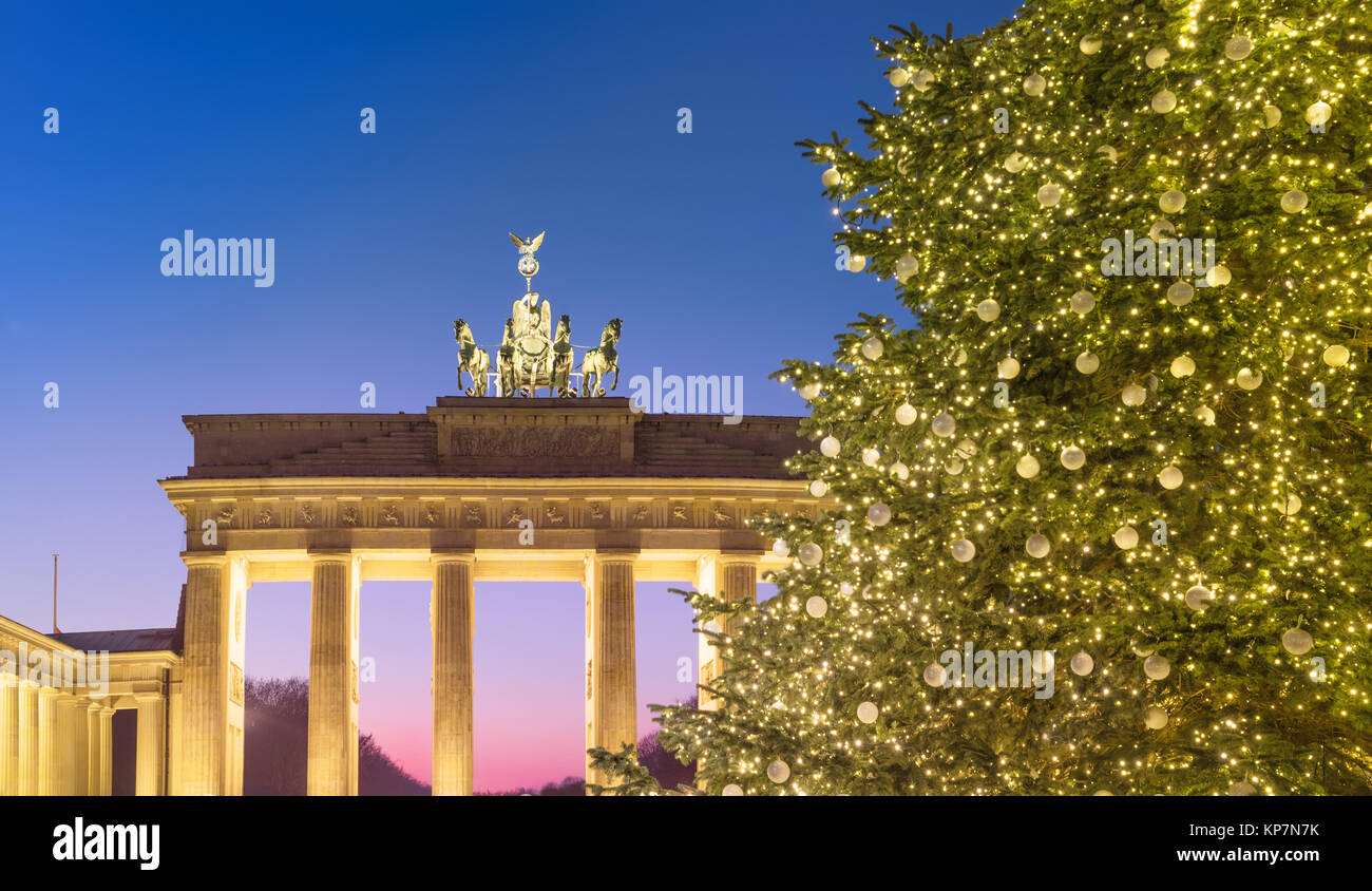 Brandenburg Gate and Christmas tree in Berlin, Germany in the evening ...