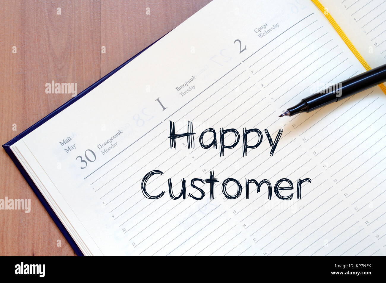 Happy customer write on notebook Stock Photo - Alamy