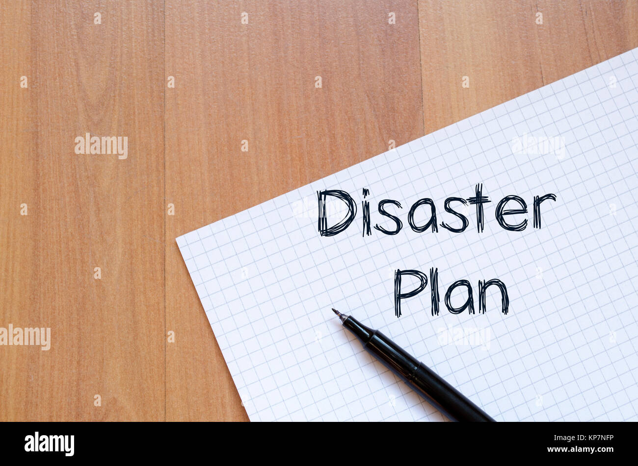 Disaster plan write on notebook Stock Photo - Alamy