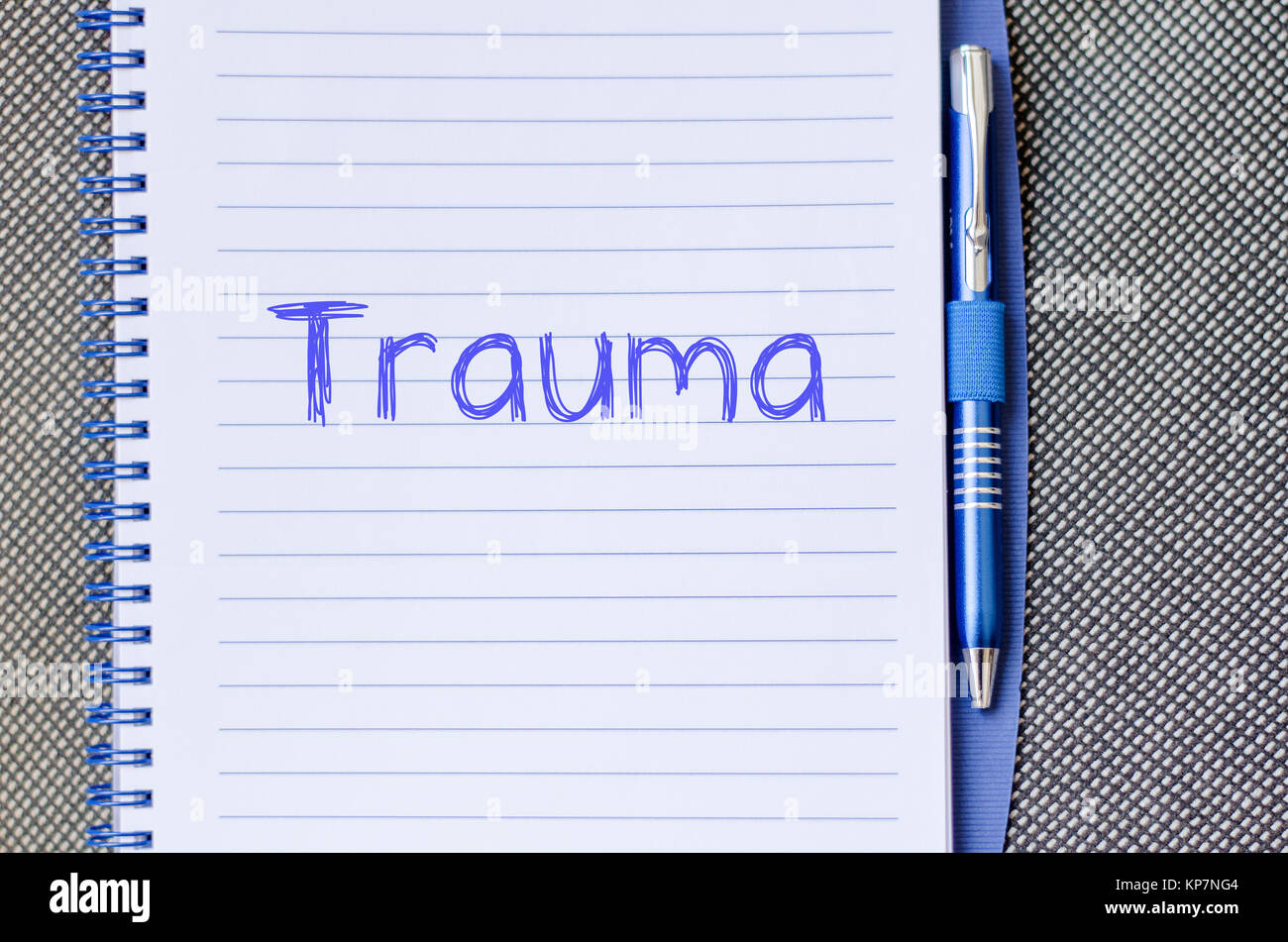 Trauma write on notebook Stock Photo - Alamy
