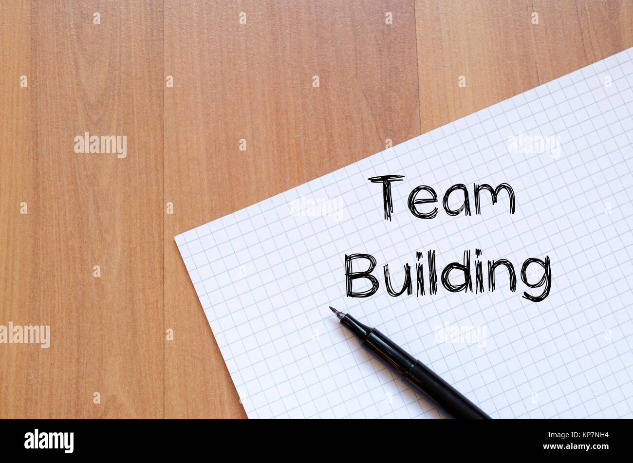 Team building write on notebook Stock Photo - Alamy