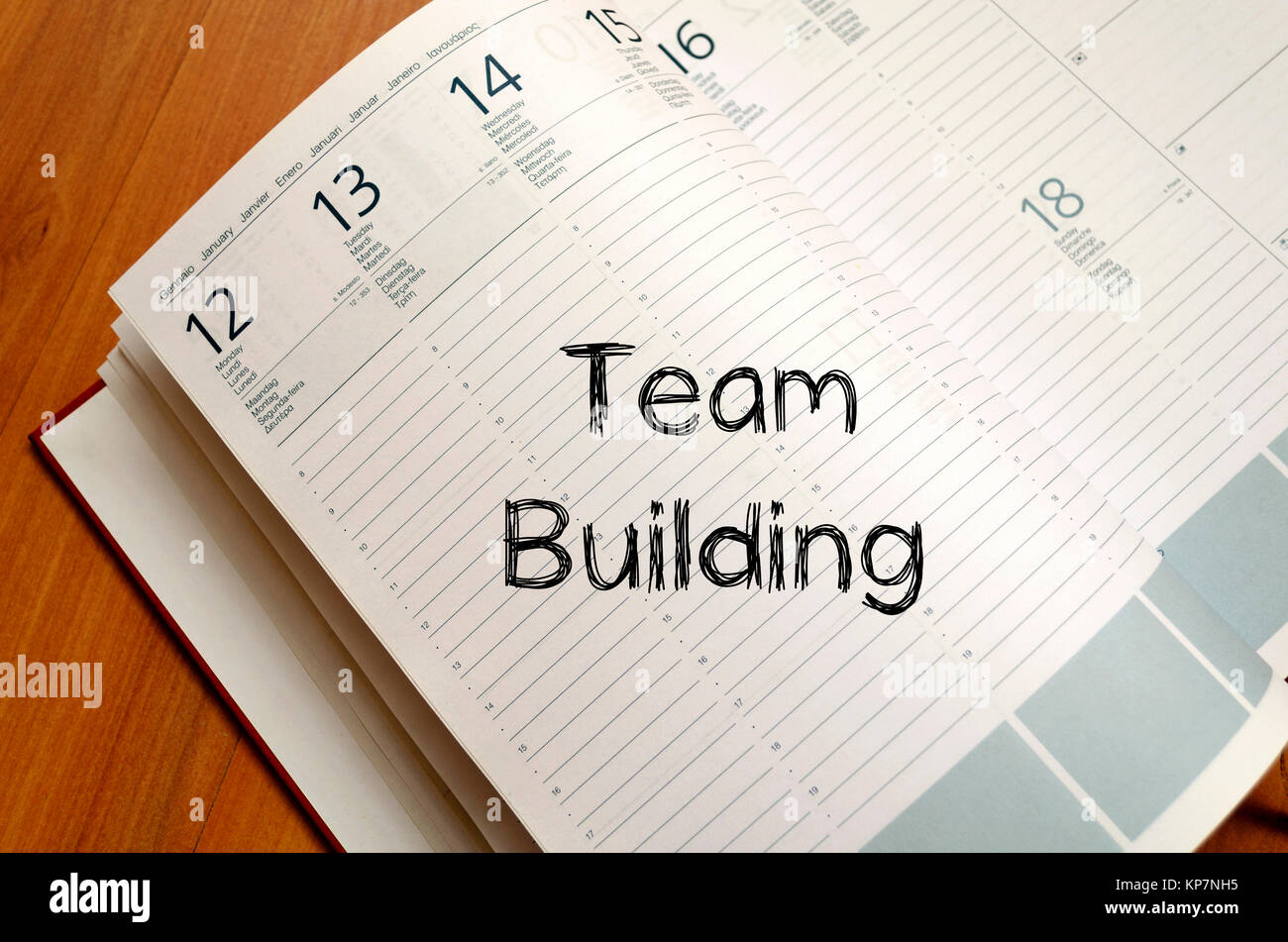 Team building write on notebook Stock Photo - Alamy